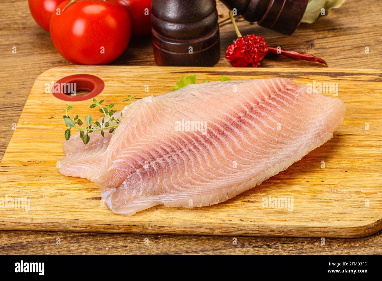 Raw tilapia fish fillet for cooking Stock Photo - Alamy