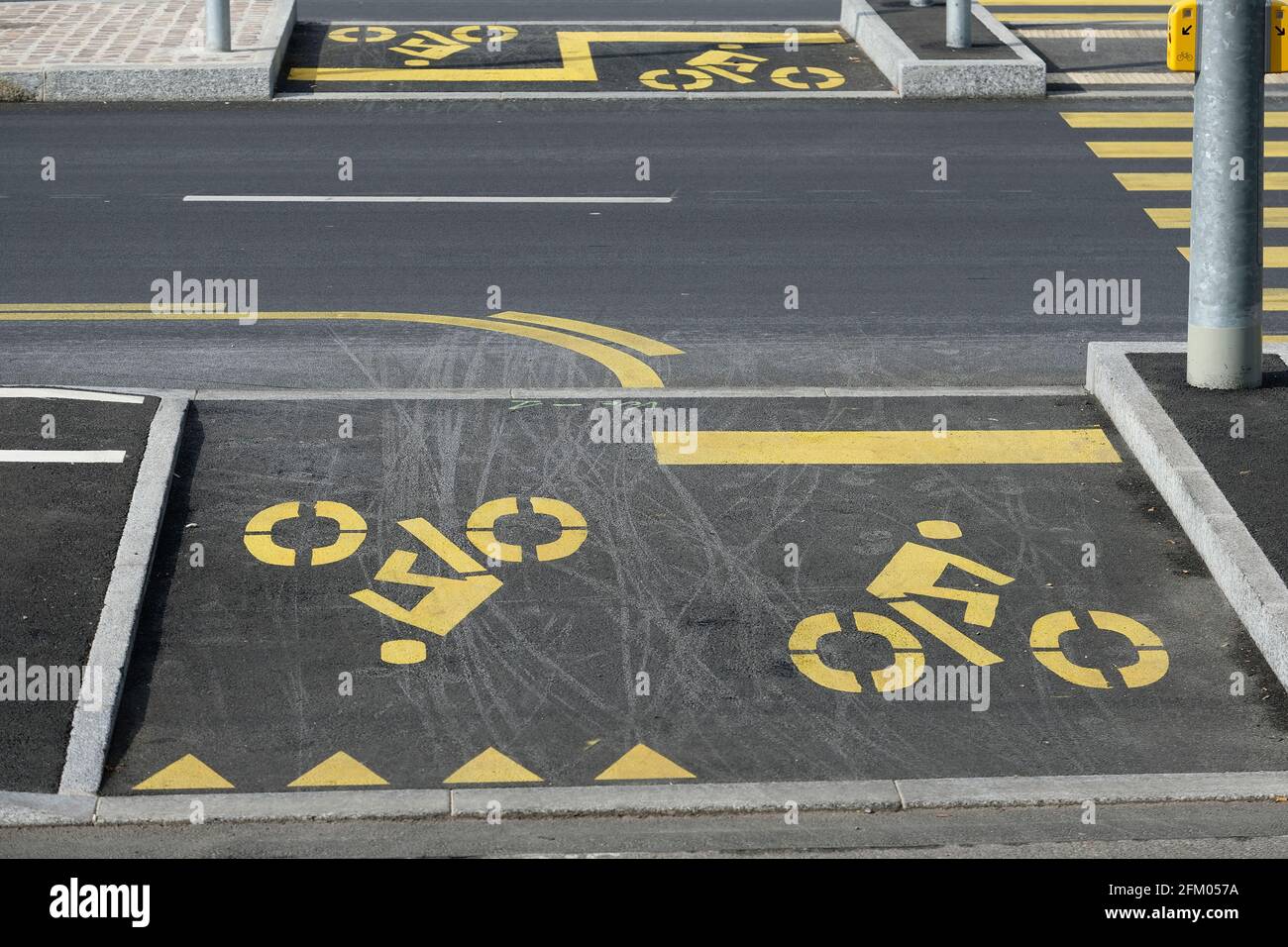 Bike lane with bike sign painting on asphalt in Geneva, Switzerland Stock Photo - Alamy