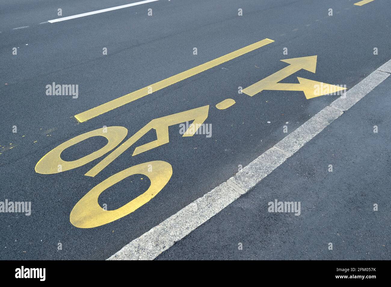Bike lane with bike sign painting on asphalt in Geneva, Switzerland Stock Photo - Alamy