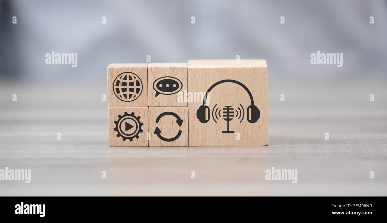 Wooden blocks with symbol of podcast concept Stock Photo - Alamy