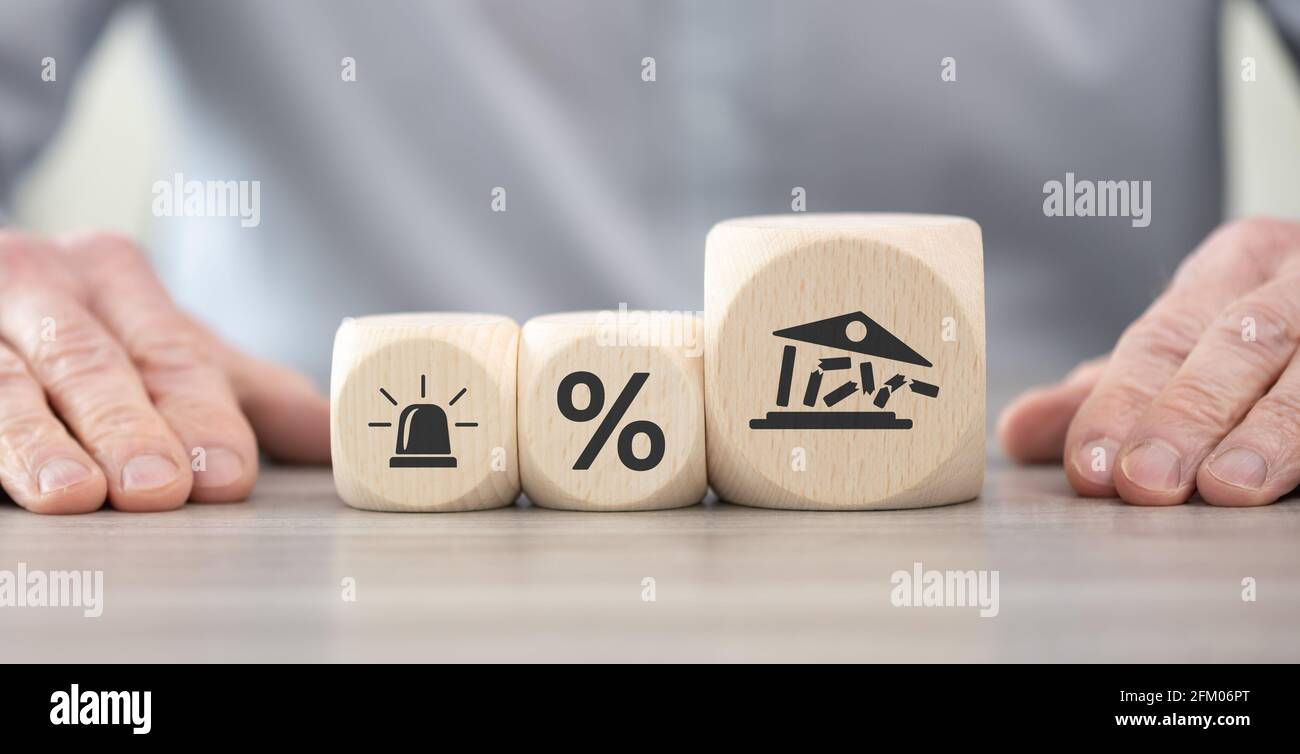 Wooden blocks with symbol of economic collapse concept Stock Photo - Alamy