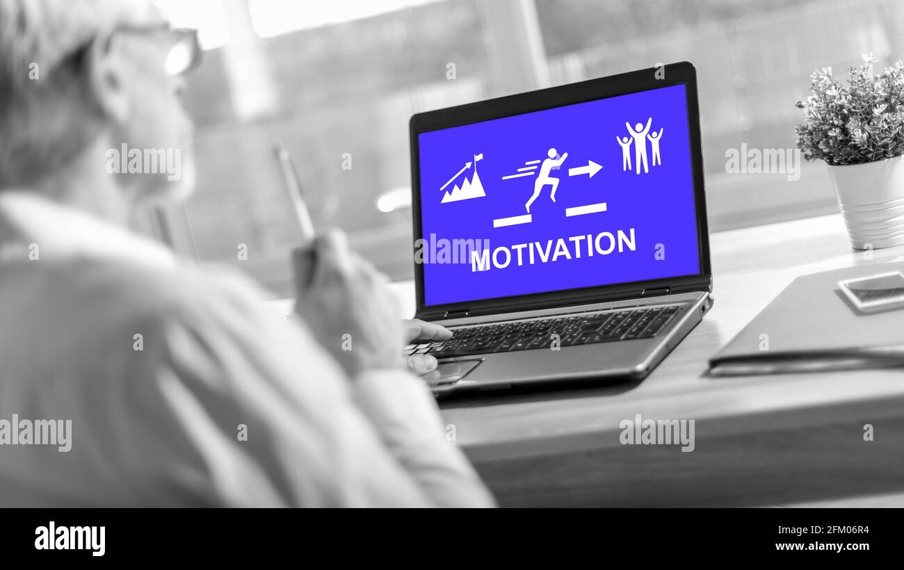 Laptop screen displaying a motivation concept Stock Photo - Alamy