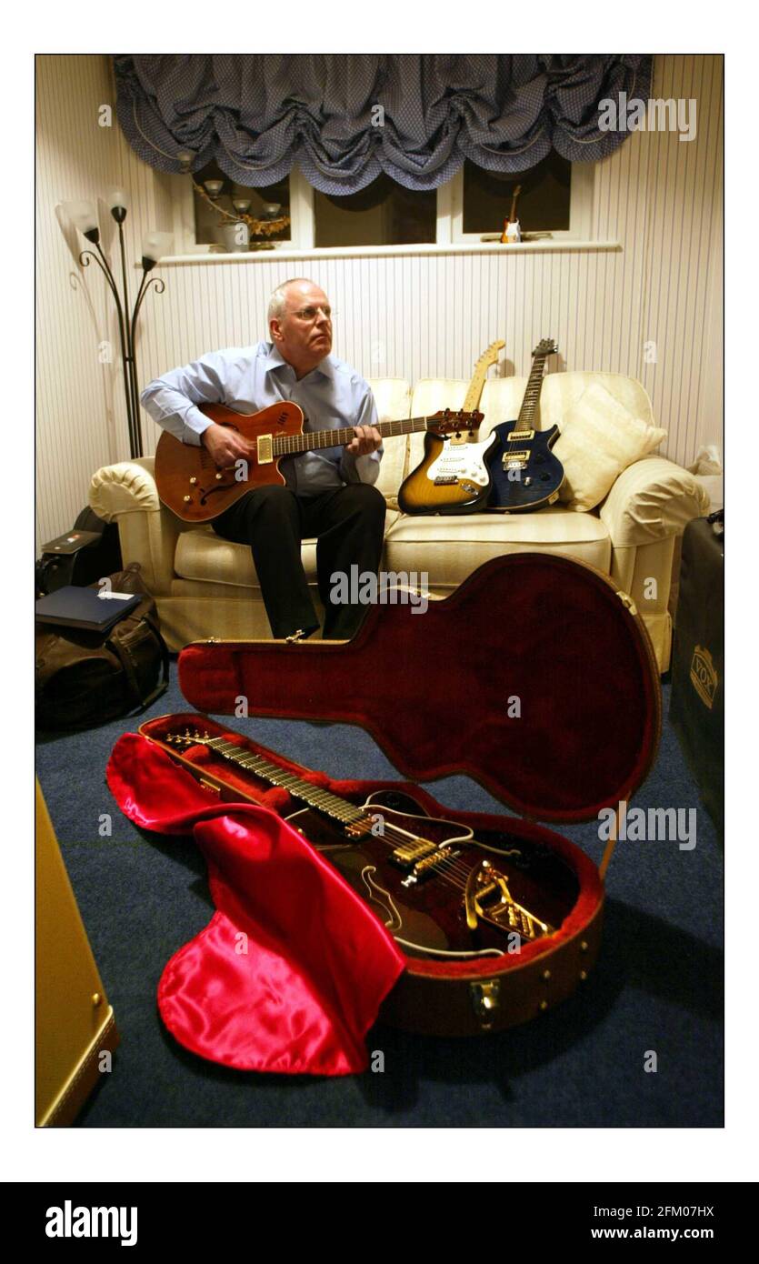 Peter Bridger with a few of his guitars.pic David Sandison 1/2/2005 ...