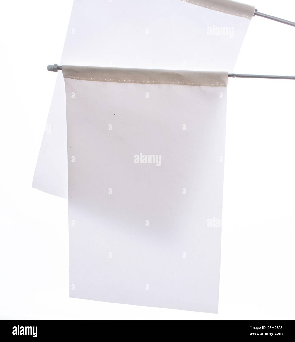 Two white flags on a white background in the display Stock Photo - Alamy