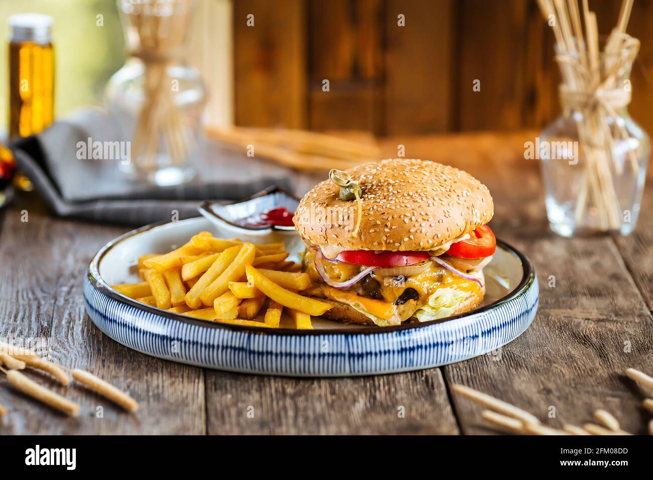 Gourmet burger set with fries on a beautiful plate Stock Photo - Alamy
