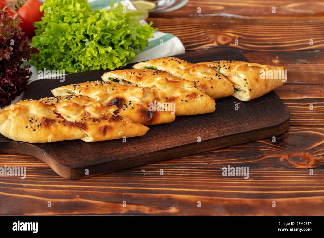 Close up of Turkish Pide bread on wooden table Stock Photo - Alamy