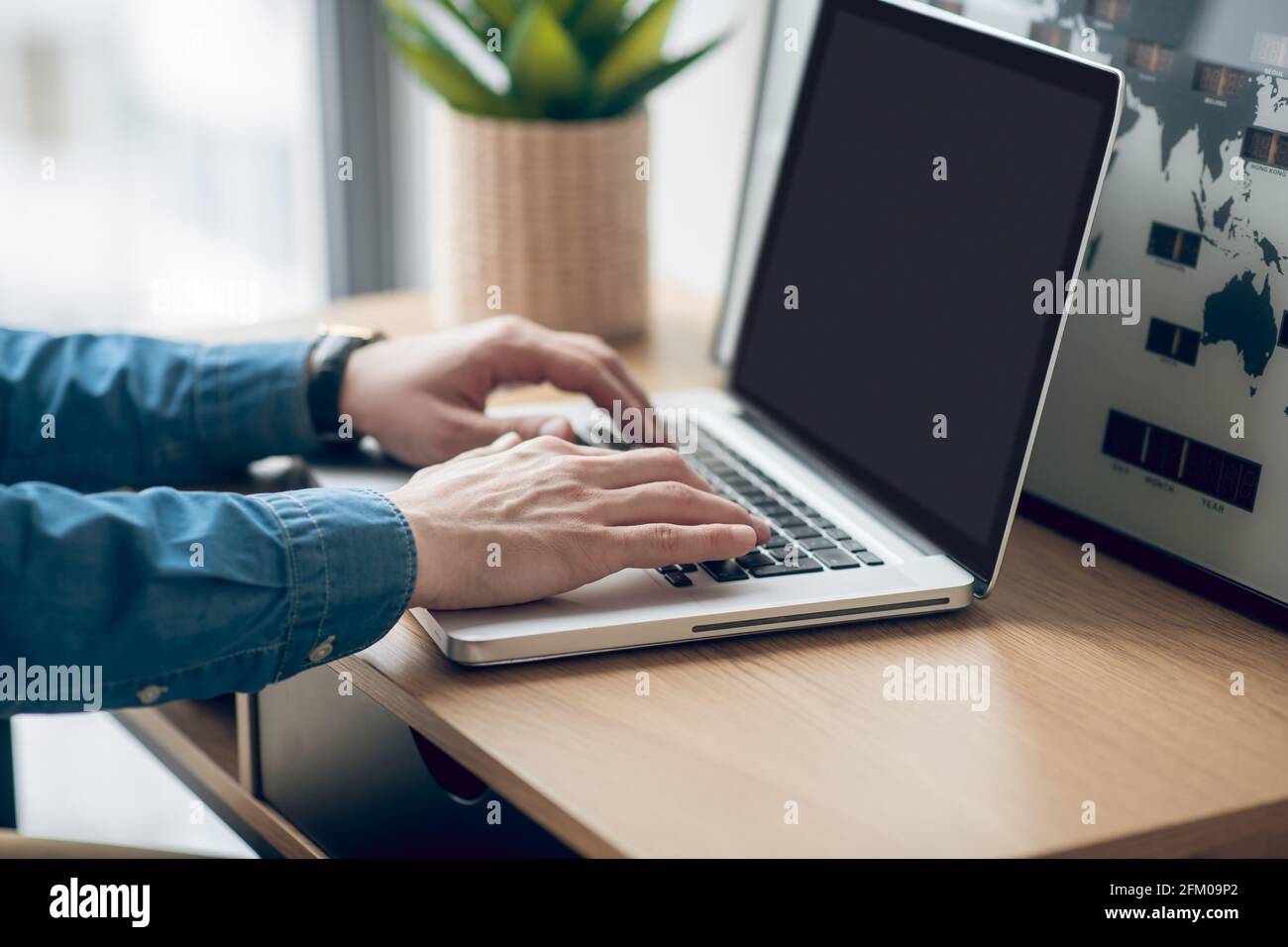 Close up picture of mans hands typing on a laptop Stock Photo - Alamy