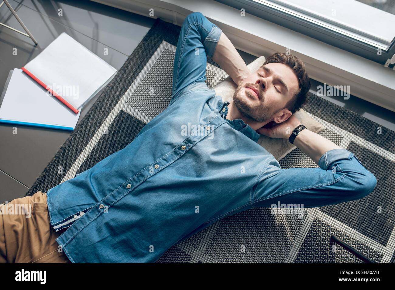 Top view of a man resting after a working day Stock Photo - Alamy
