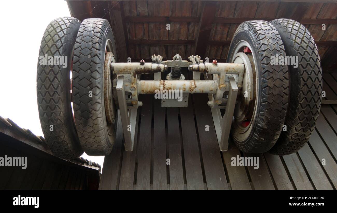 Rustic Dual-Tire Assembly Hanging Under Rustic Roof Structure Stock ...