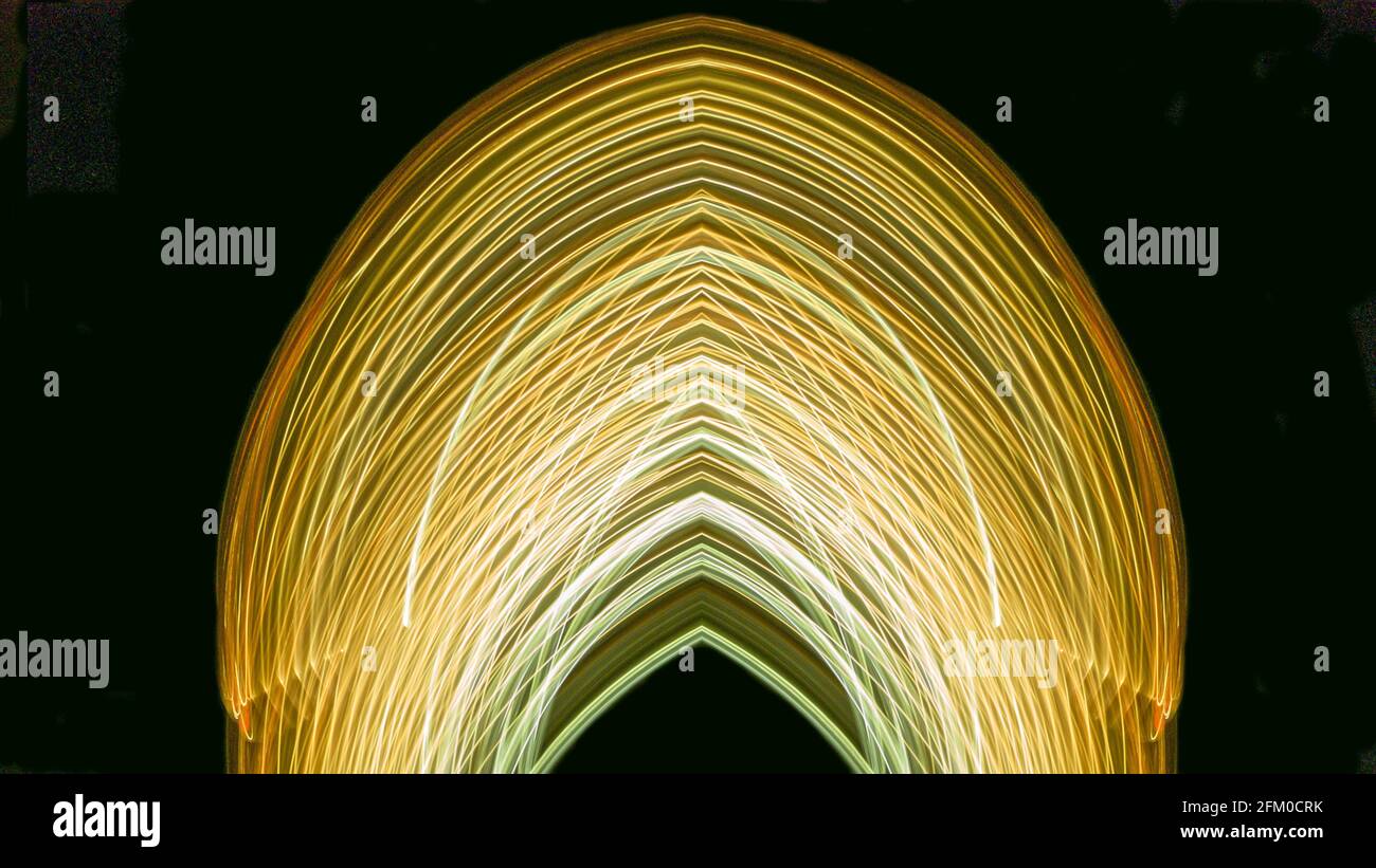 Light arc in yellow colors on a black background Stock Photo - Alamy