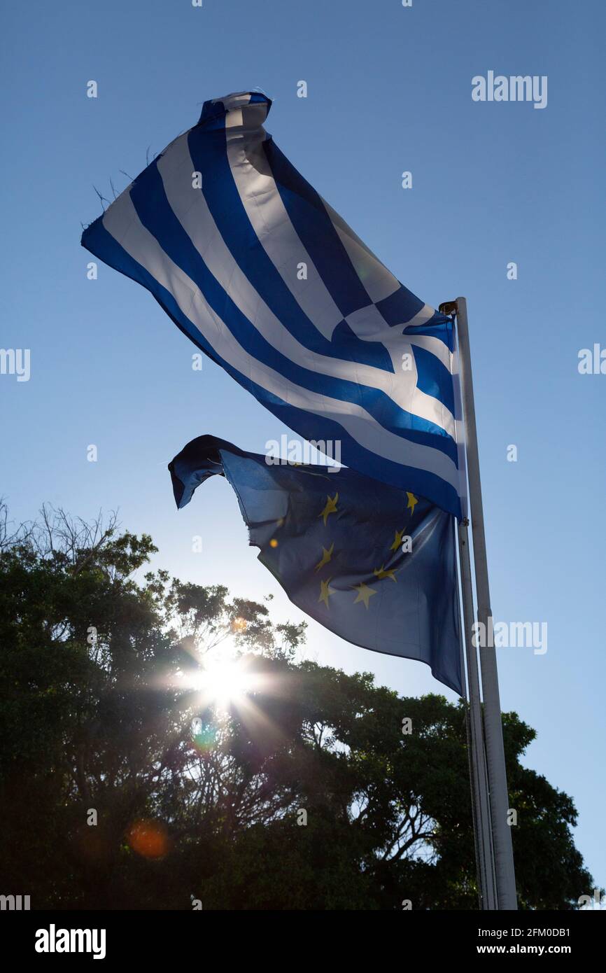 The flags of Greece and the European Union fly in the city of Rhodes ...