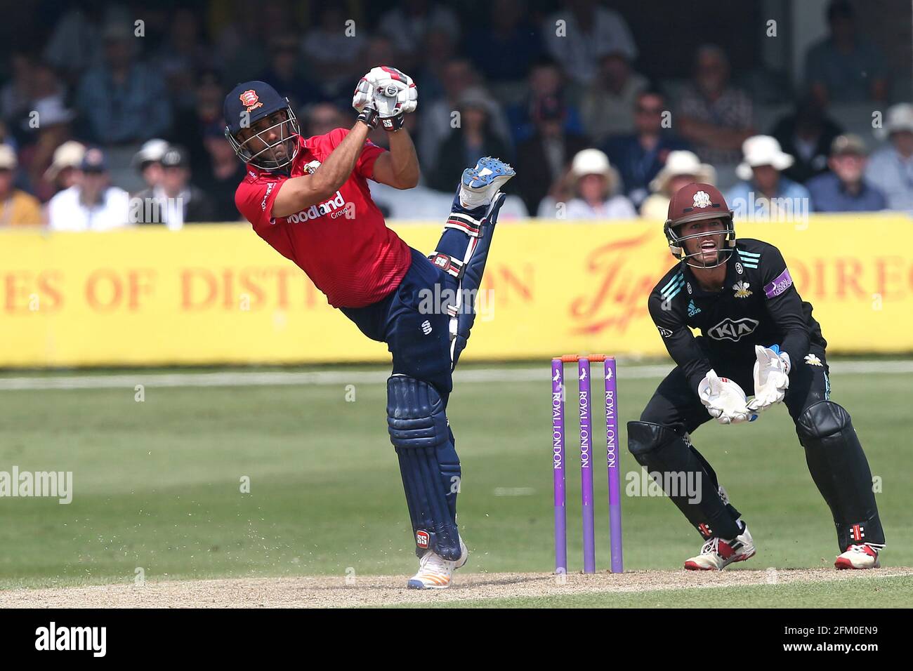Ravi Bopara hits 4 runs for Surrey as Ben Foakes looks on from behind ...