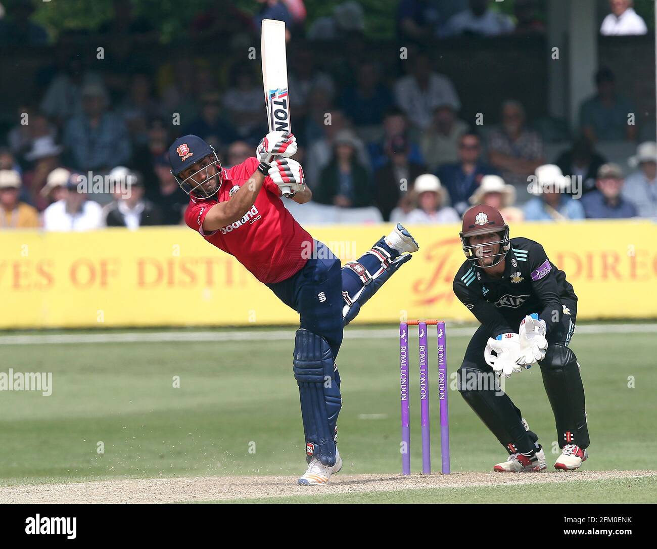 Ravi Bopara hits 4 runs for Surrey as Ben Foakes looks on from behind ...