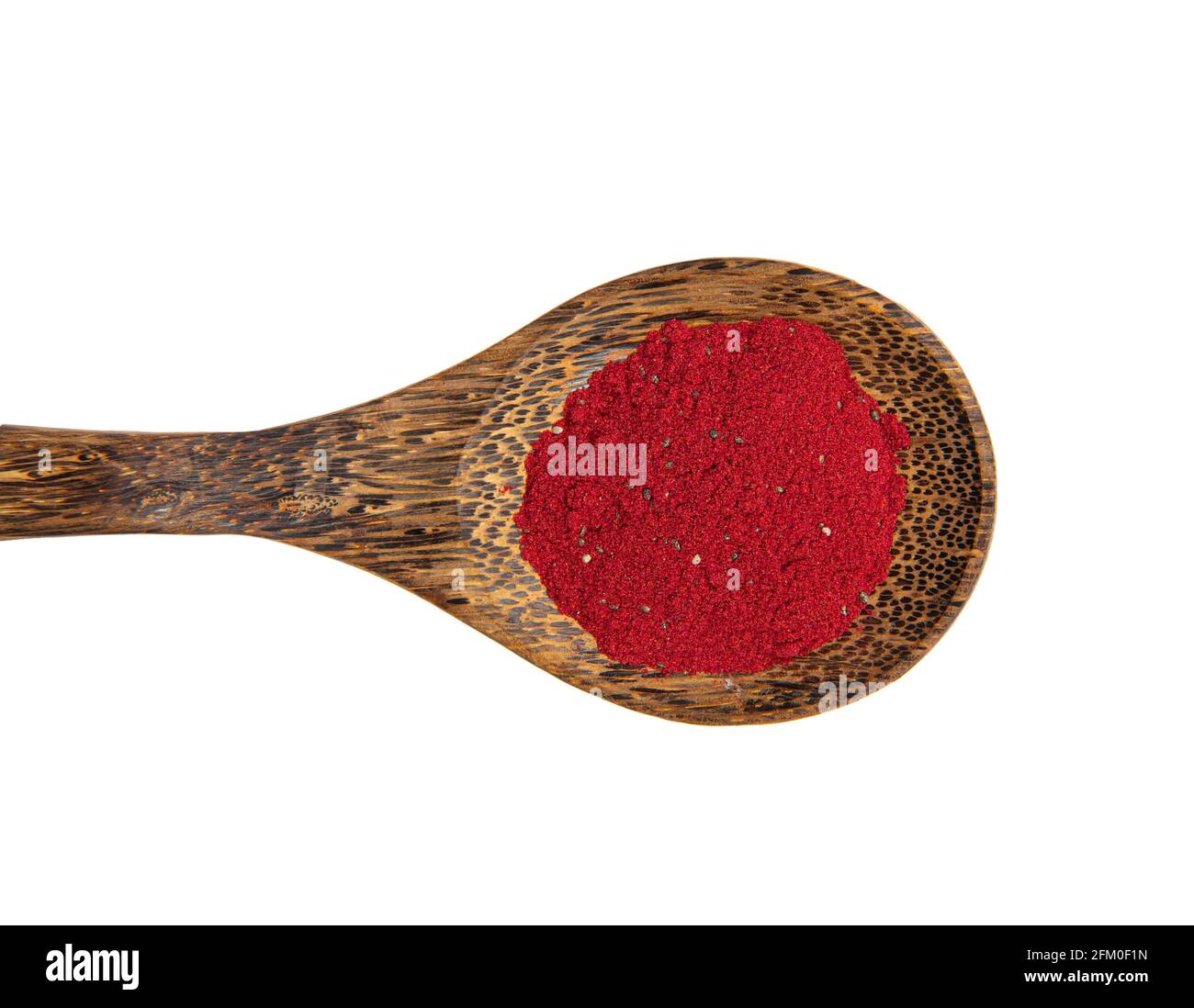 Flat lay view of red color beetroot superfood powder on wood spoon ...