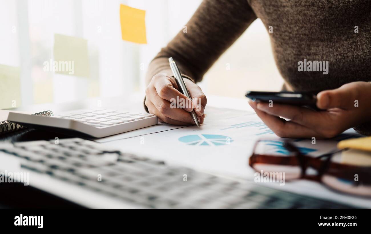Business woman accountant working audit and calculating expense ...