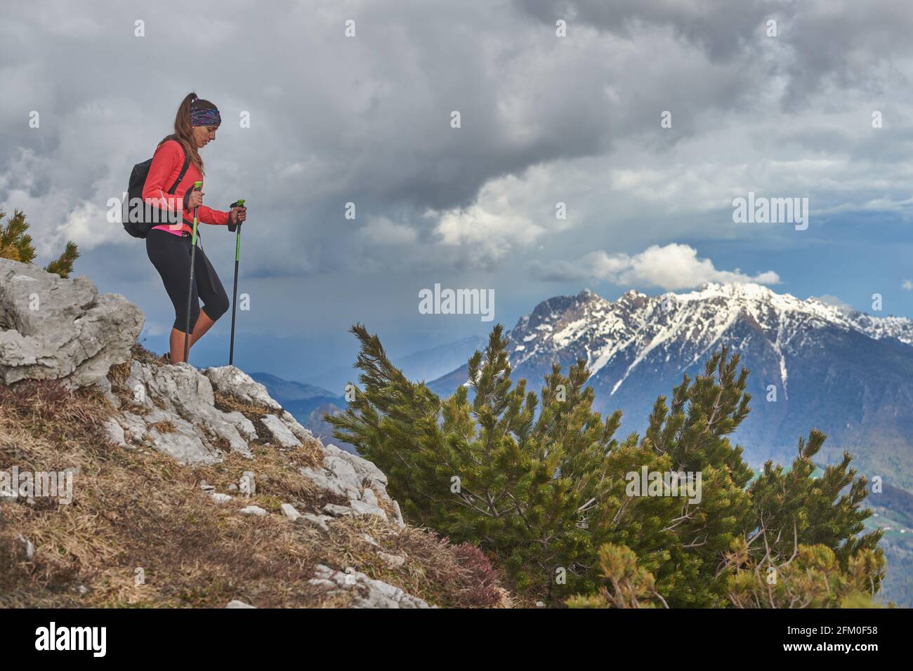 Descent girl during an alpine trekking on the Alps Stock Photo - Alamy