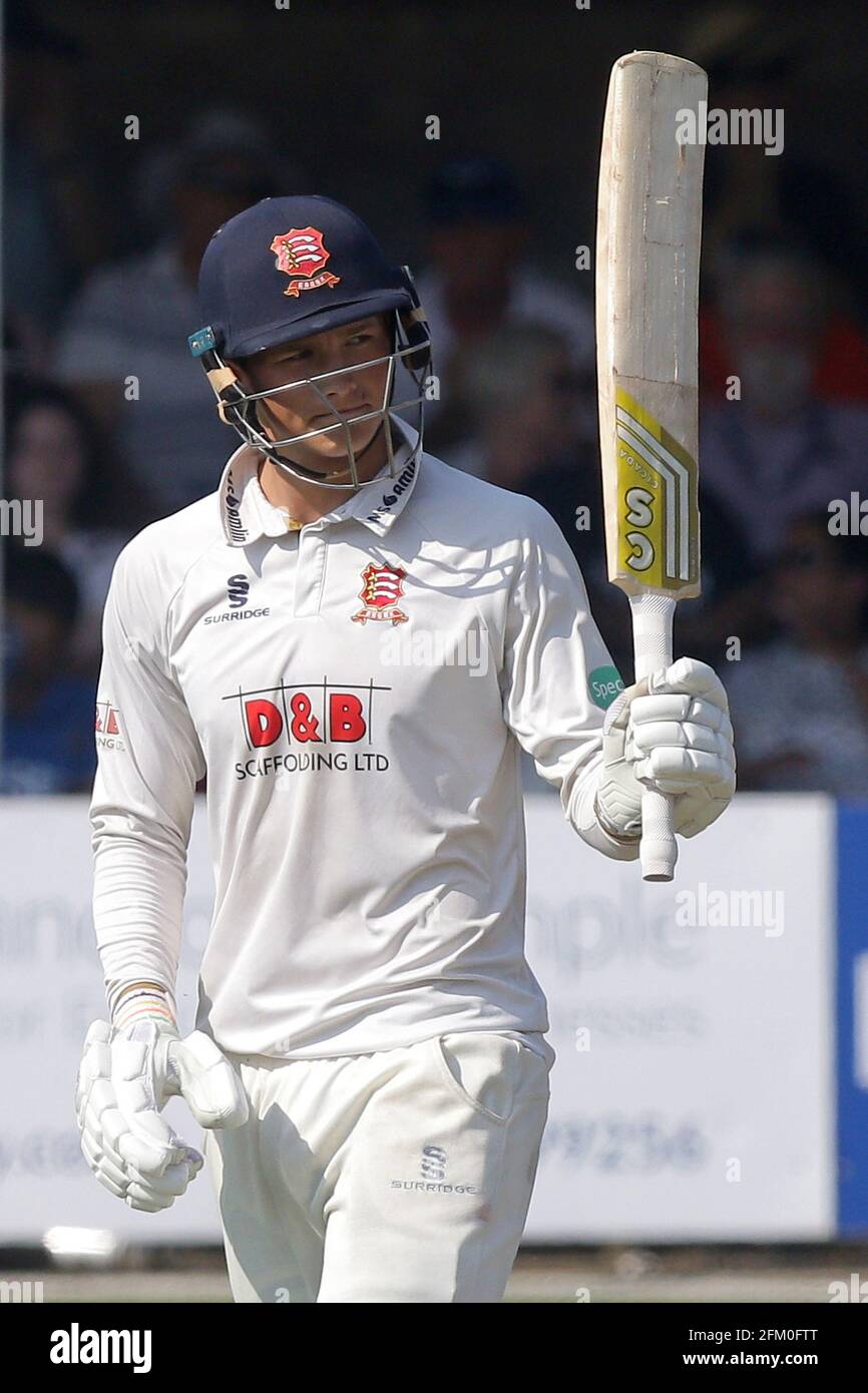 Michael Pepper of Essex raises his bat to celebrate reaching his fifty ...