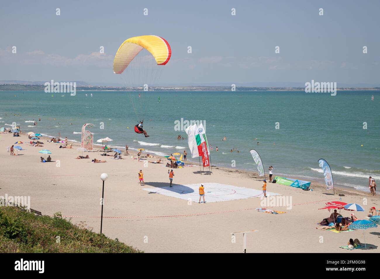 Race suit landing paraglider - paraglider lands in the goal on the ...
