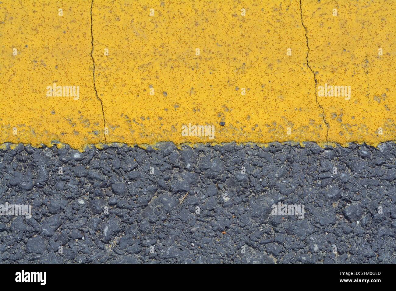 Close up of an asphalt road surface with painted yellow line Stock ...
