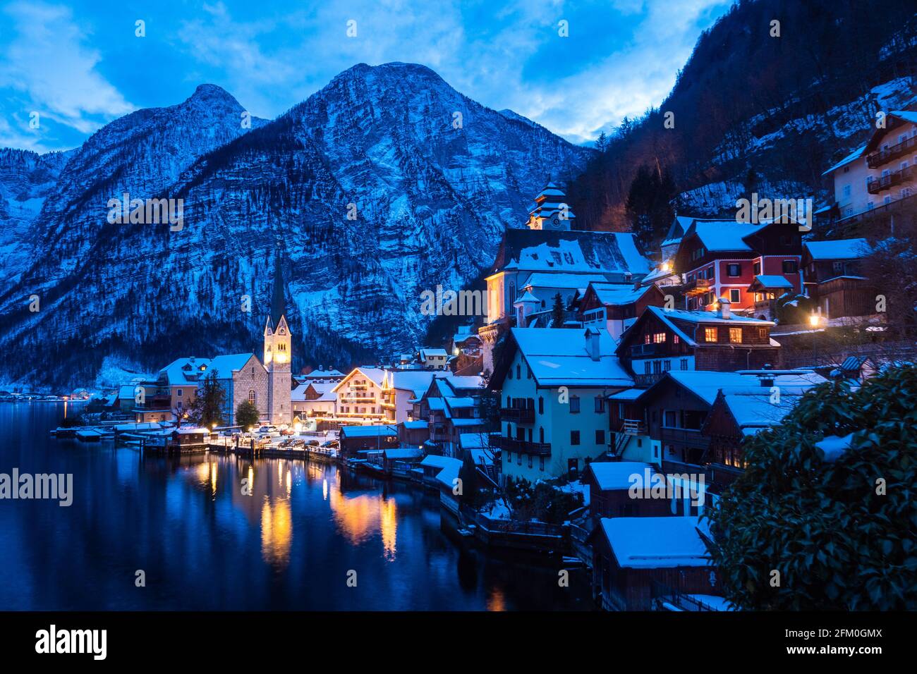 Hallstatt Cityscape on a Cold Winter Evening Covered with Snow with the ...