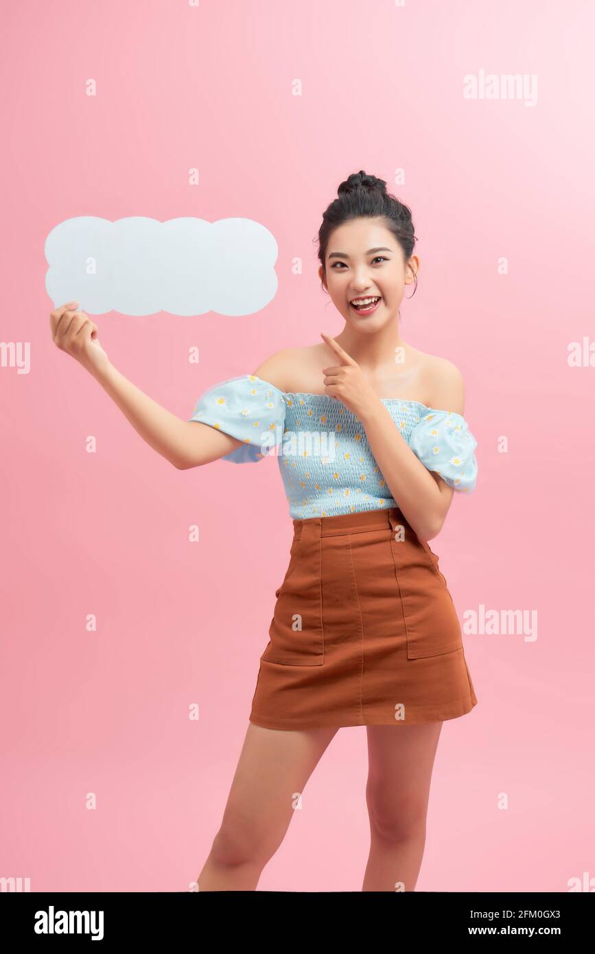 Attractive asian female with empty message box Stock Photo - Alamy