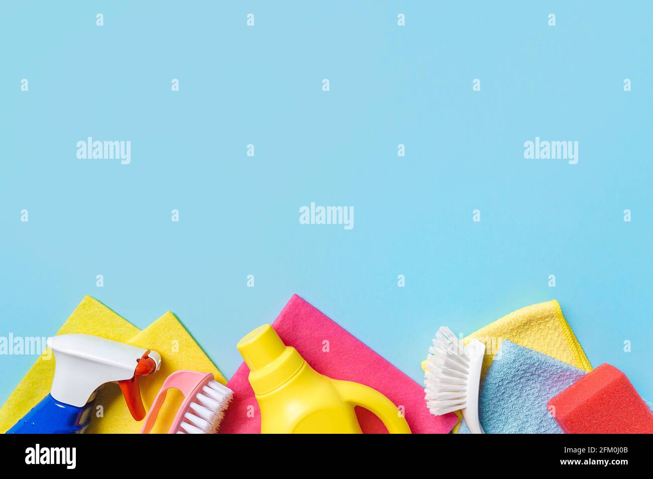 House cleaning product on blue background, copy space. Flat lay or top ...