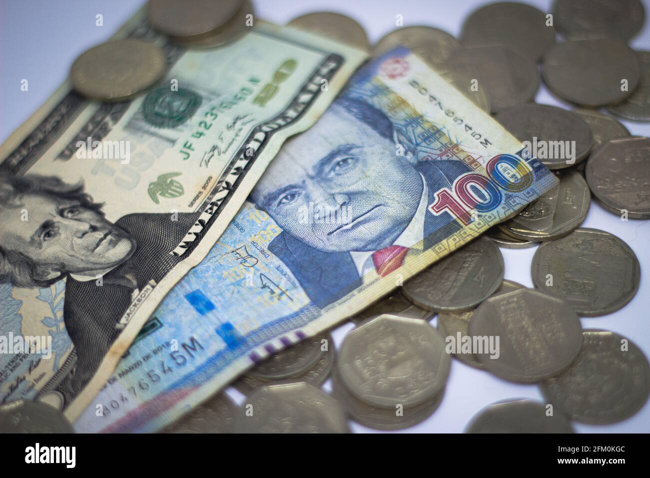 Closeup of Peruvian sol and US dollar bills on white background Stock ...