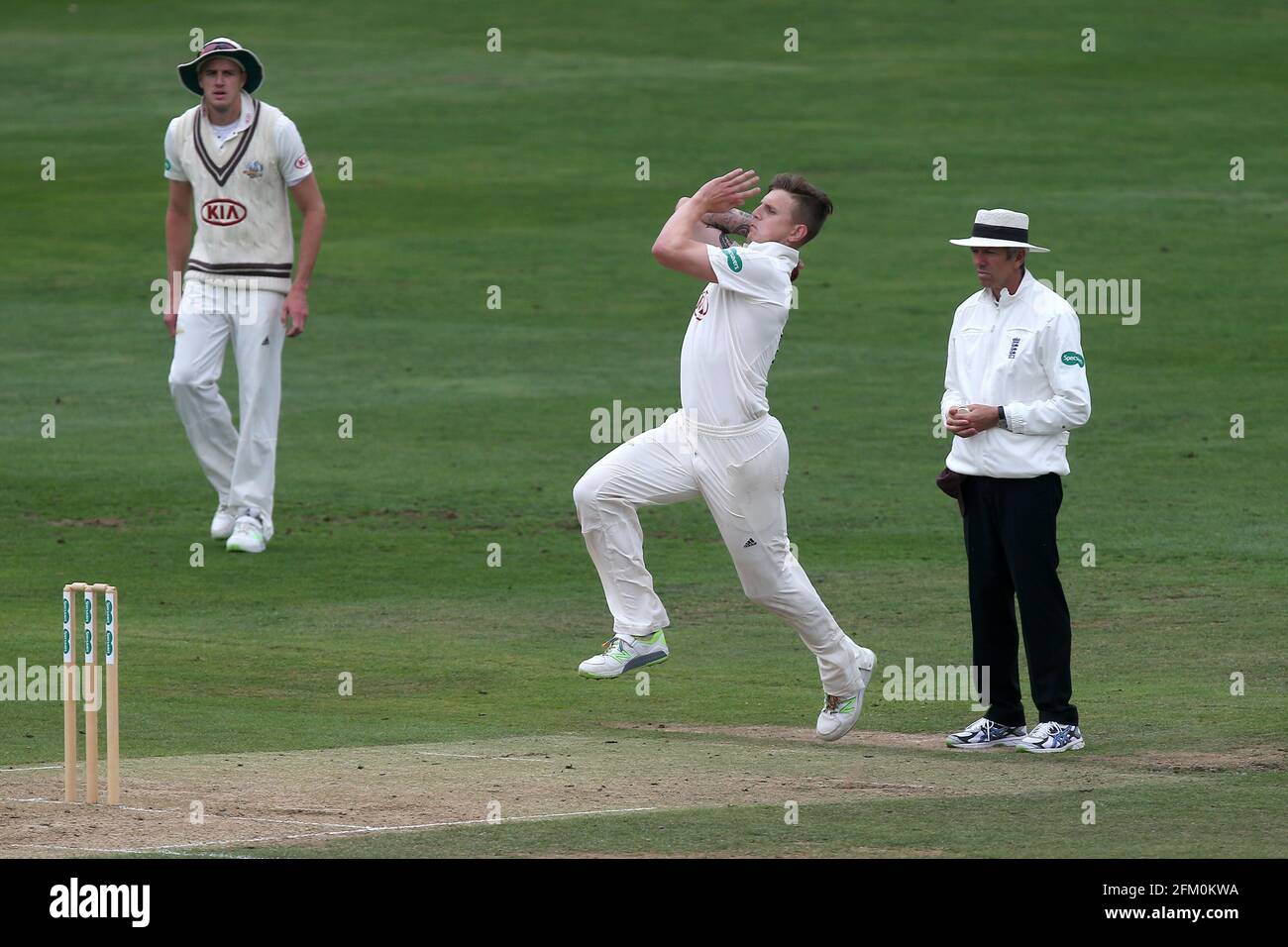 Conor McKerr in bowling action for Surrey during Essex CCC vs Surrey ...