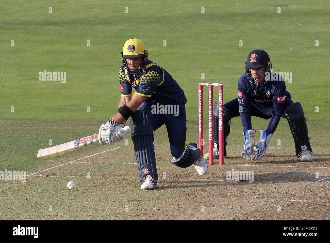 Colin Ingram hits 4 runs for Glamorgan as Adam Wheater looks on from ...