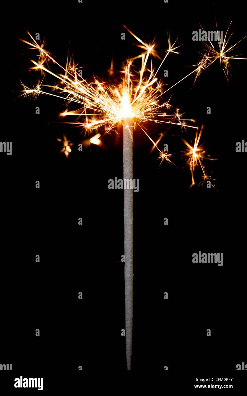 A sparkler on a black background Stock Photo - Alamy