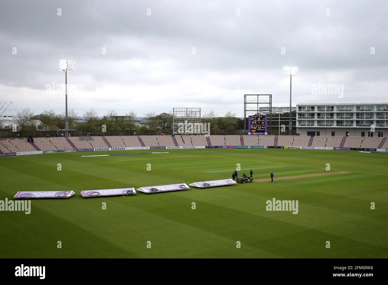 The covers are brought on as bad light stops play during Hampshire CCC ...