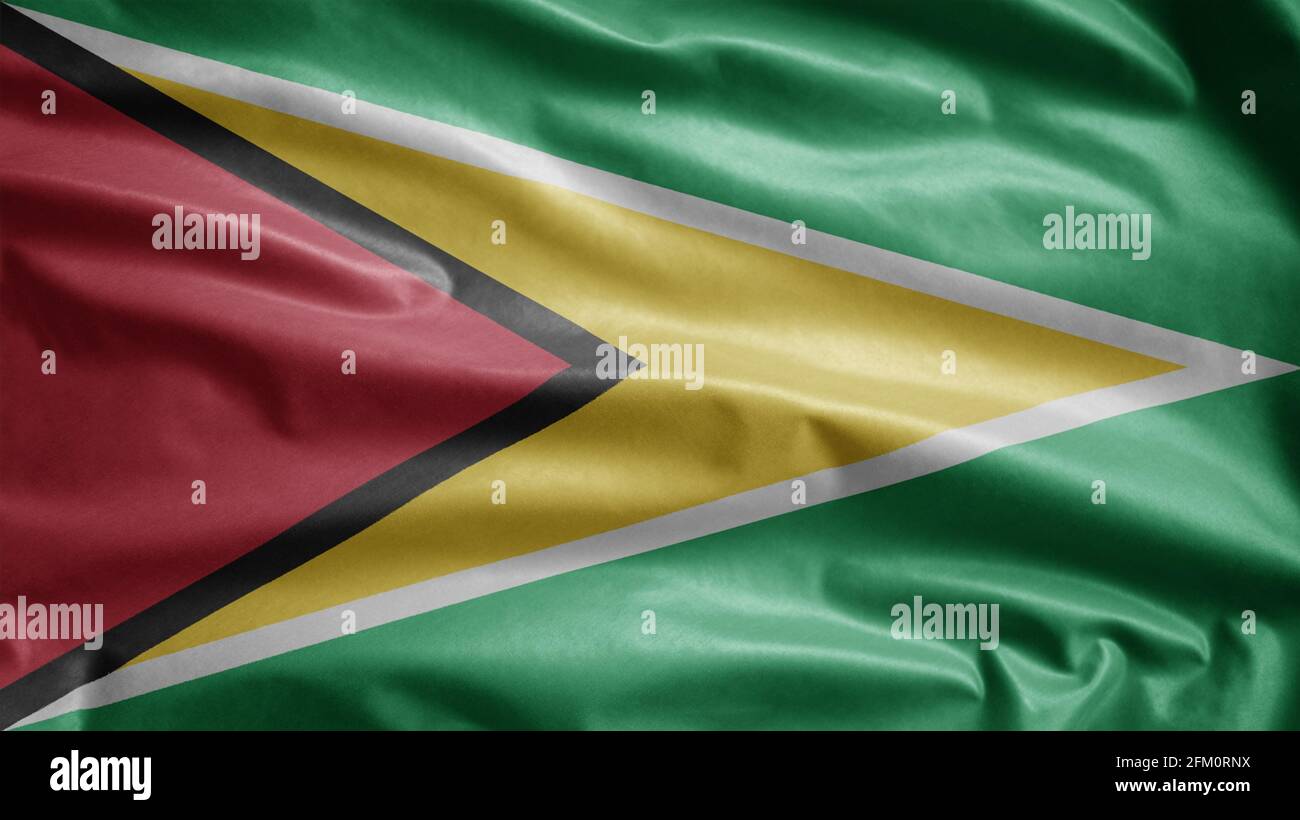 Guyanese flag waving in the wind. Close up of Guyana banner blowing, soft and smooth silk. Cloth ...