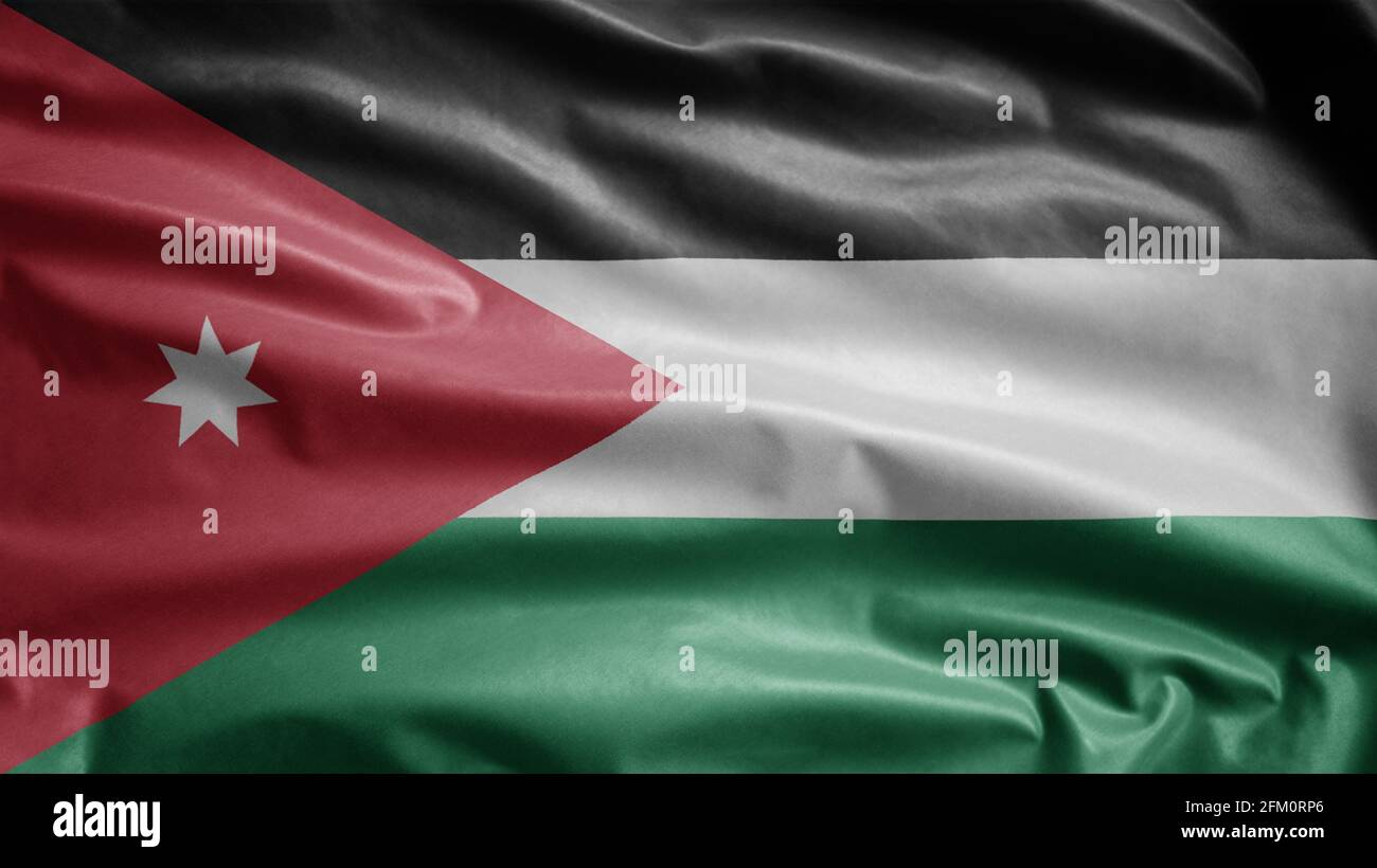 Jordan flag waving in the wind. Close up of Jordania banner blowing ...