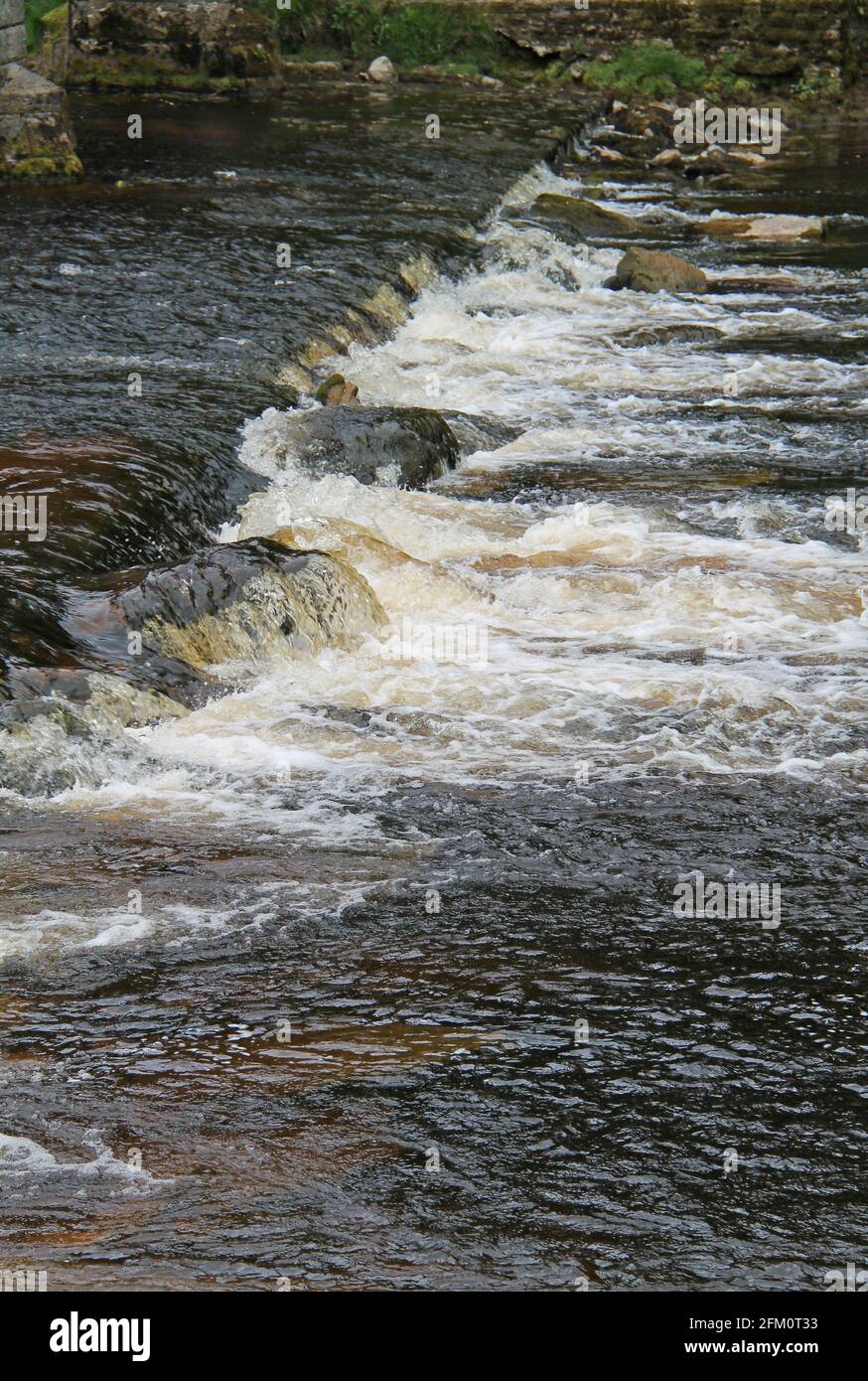 A Shallow Weir Across a Wide Fast Flowing River Stock Photo - Alamy
