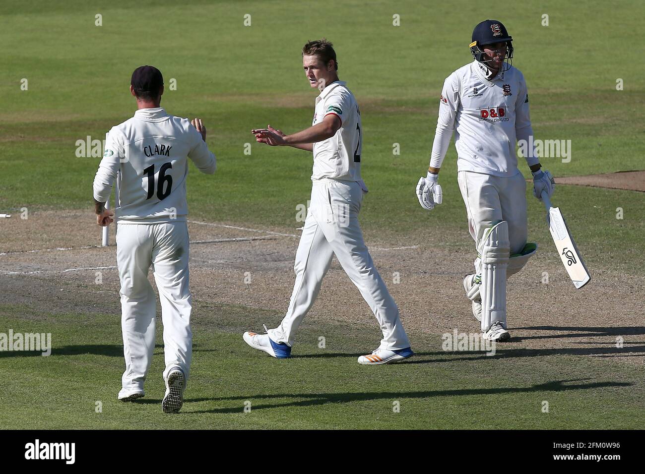 Joe Mennie of Lancashire (C) celebrates taking the wicket of Daniel ...