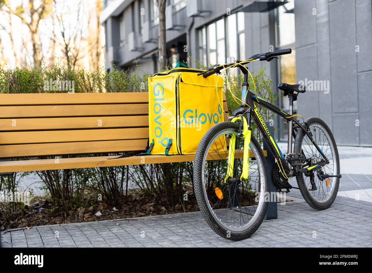 KIEV, UKRAINE - April 28, 2021: Glovo bike courier on the street ...