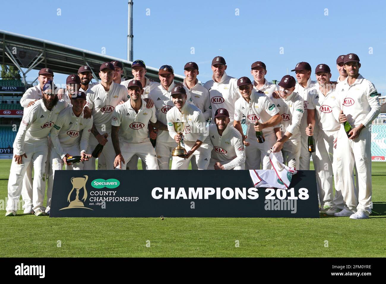 Surrey players celebrate with the Championship Trophy during Surrey CCC ...