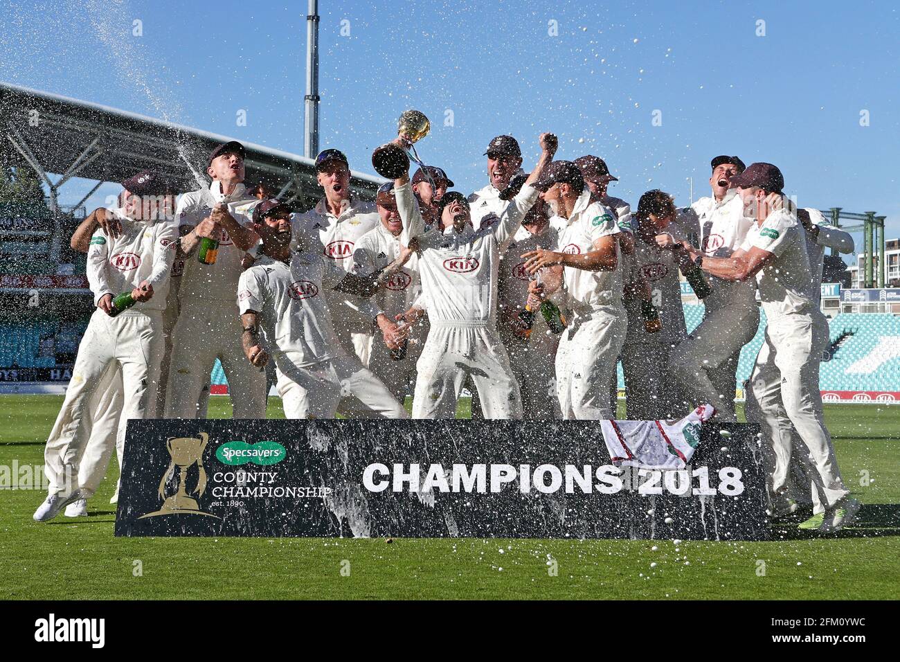 Surrey players celebrate with the Championship Trophy during Surrey CCC ...