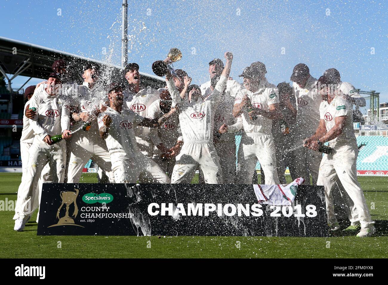 Surrey players celebrate with the Championship Trophy during Surrey CCC ...