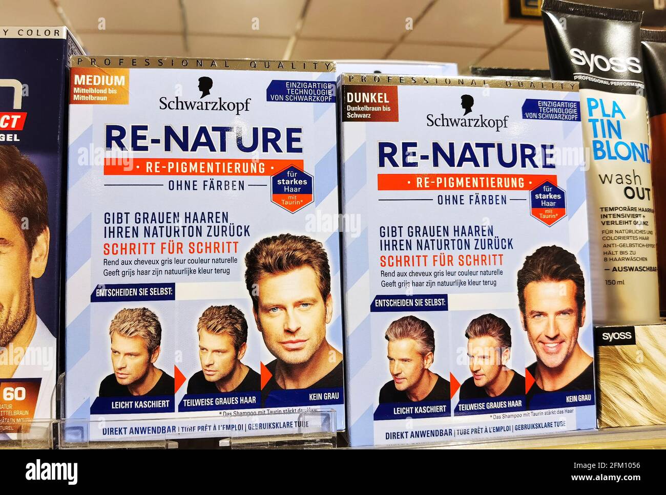 Berlin, Germany - April 22, 2021: View to a shelf with packs of hair ...