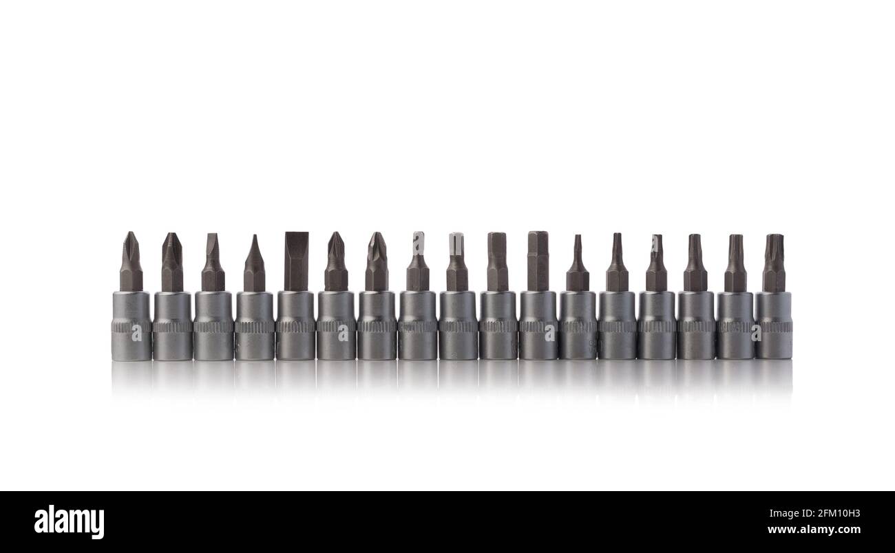 Set of interchangeable hand screwdrivers on a white background ...
