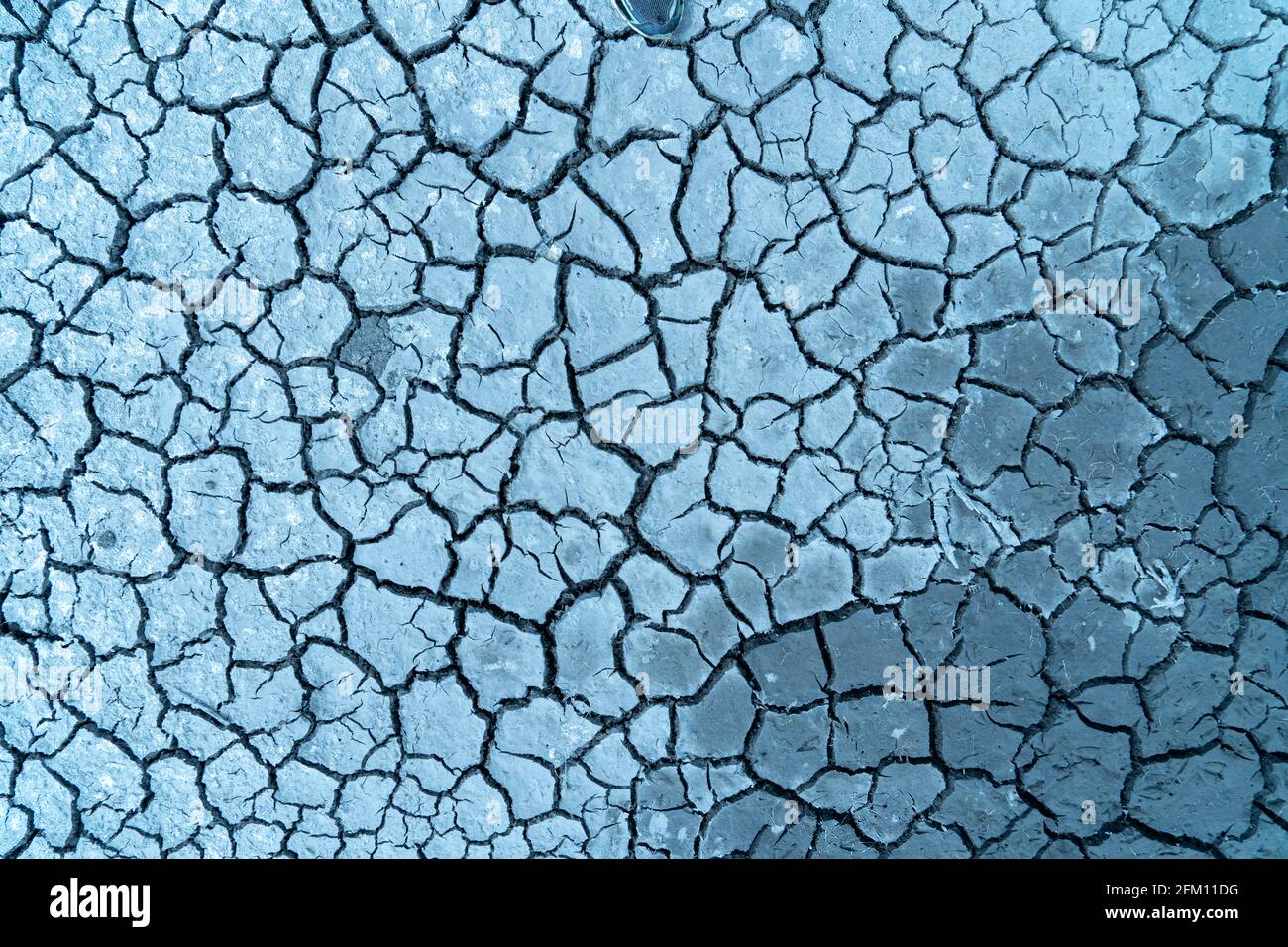 Mudflat cracked desert barren surface for natural background, layer, wallpaper, photo effect ...