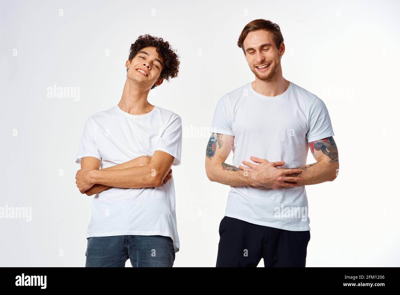 two man in white t-shirts are standing next to friendship emotions ...