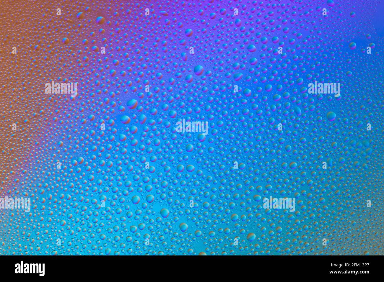 Colored abstract background from drops on glass. Rainbow color ...