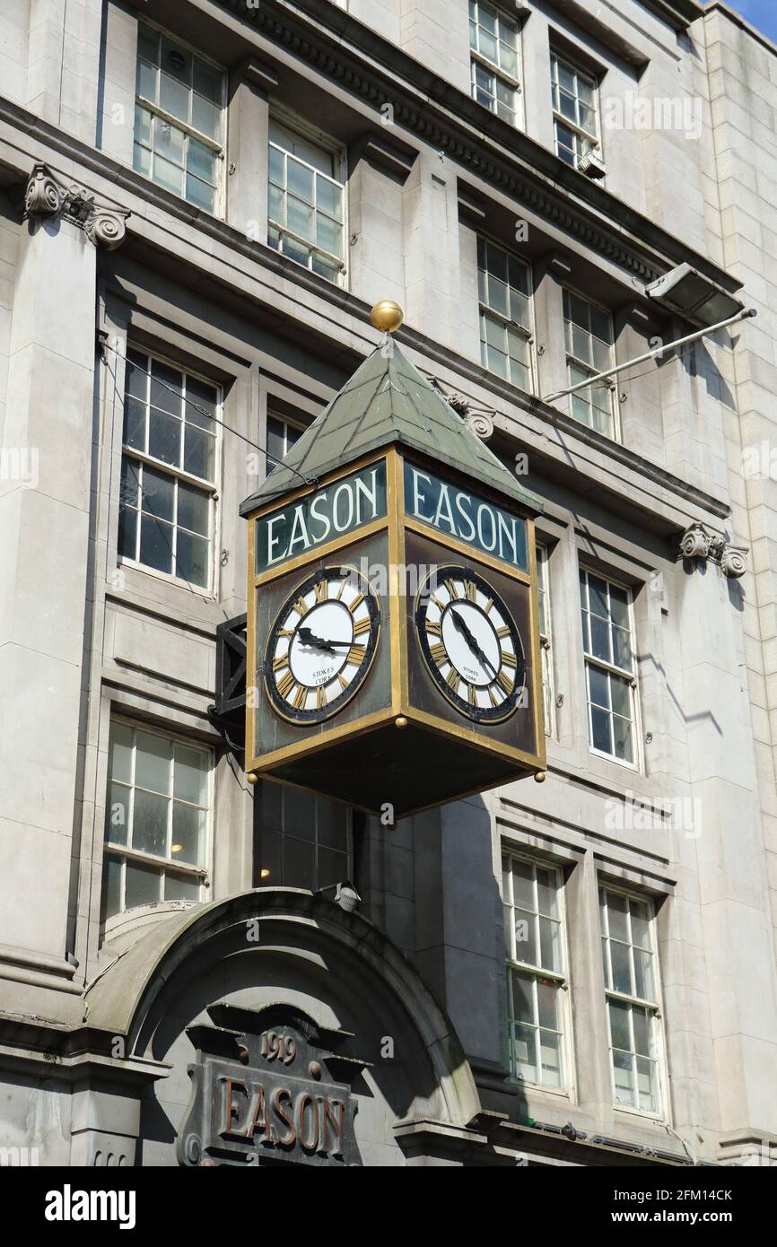 Clock hanging on building hi-res stock photography and images - Alamy