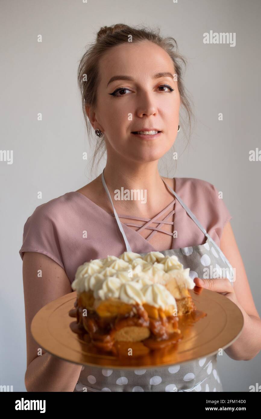 Young chef cook holds cake hi-res stock photography and images - Alamy