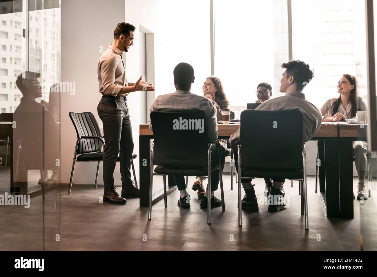 Colleagues having meeting in boardroom, businessman giving speech Stock ...