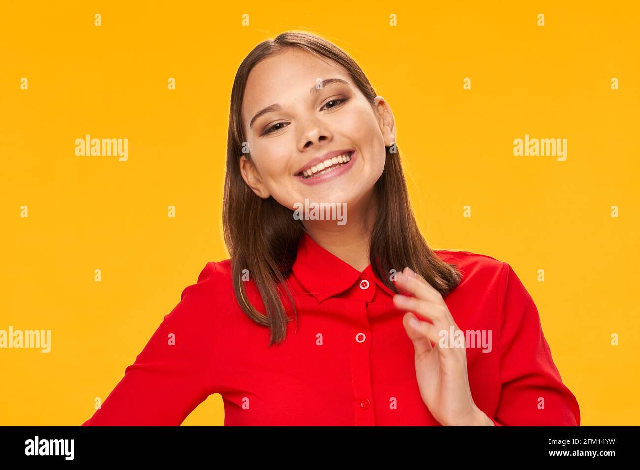 cheerful woman in red shirt smile yellow isolated background Stock ...