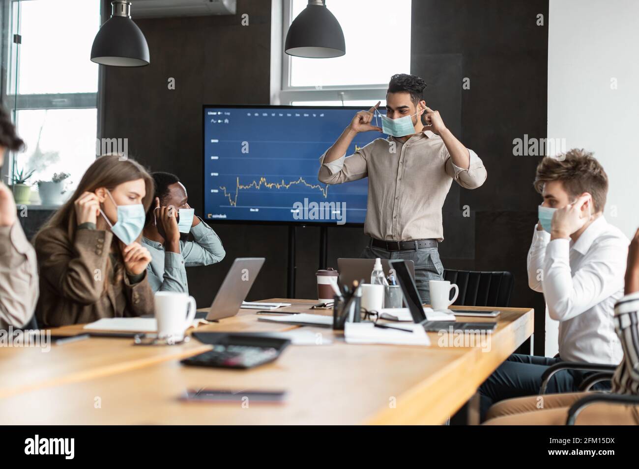 International people wearing medical masks at work Stock Photo - Alamy
