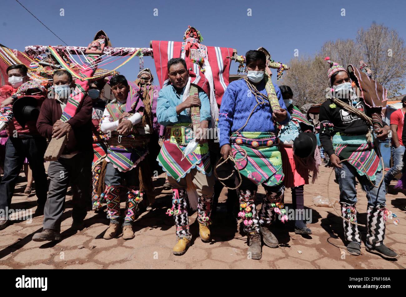 Macha, Bolivia. 04th May, 2021. Participants carry crosses with figures ...